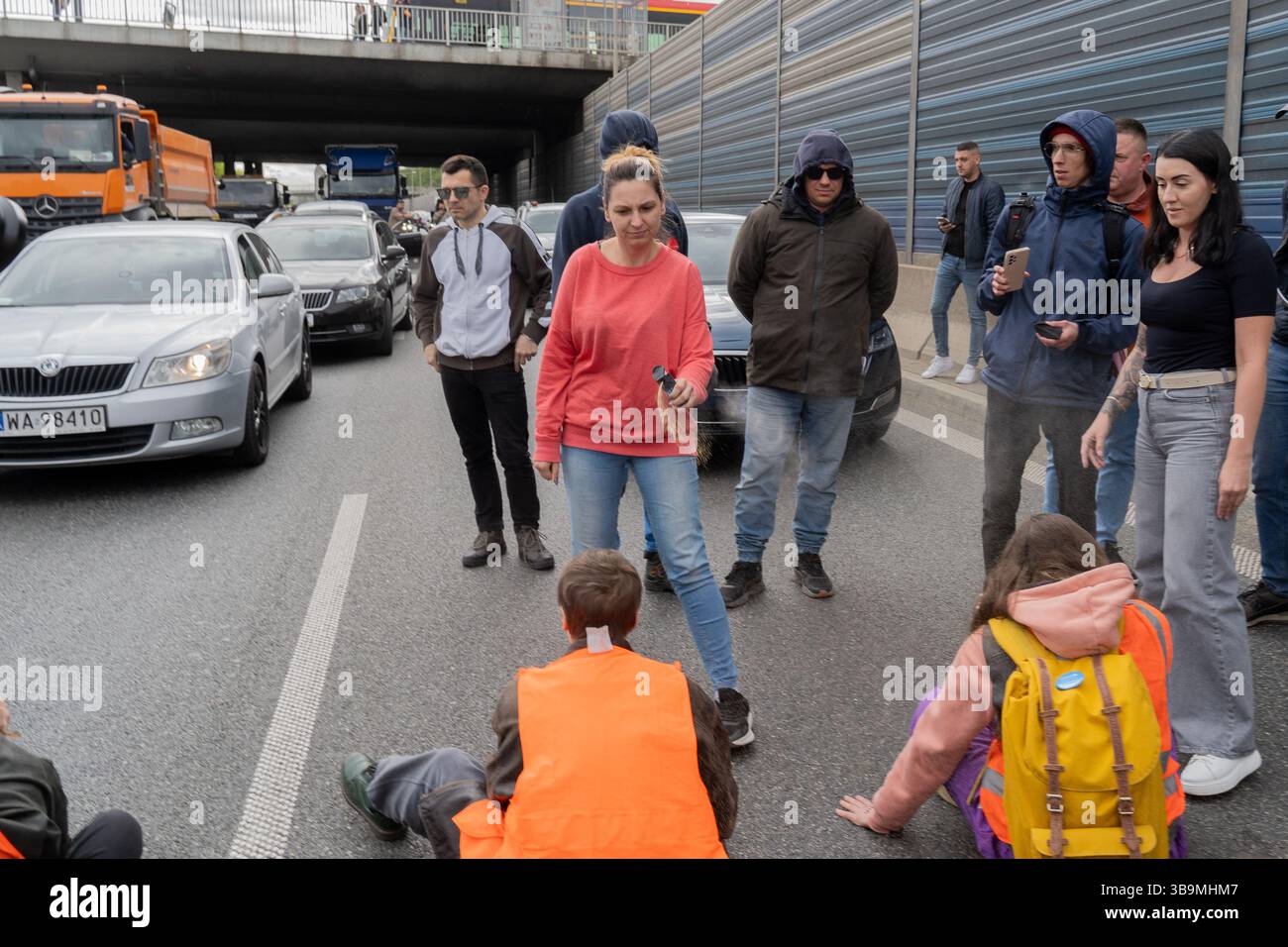 A driver uses pepper spray against members of the Ostatnie Pokolenie ...