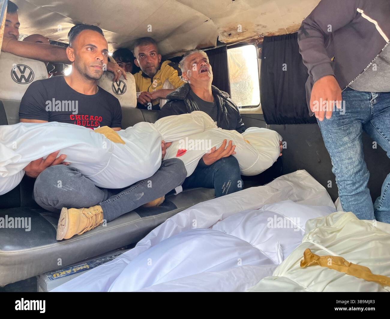 Palestinians mourn the loss of their loved ones killed in an Israeli ...