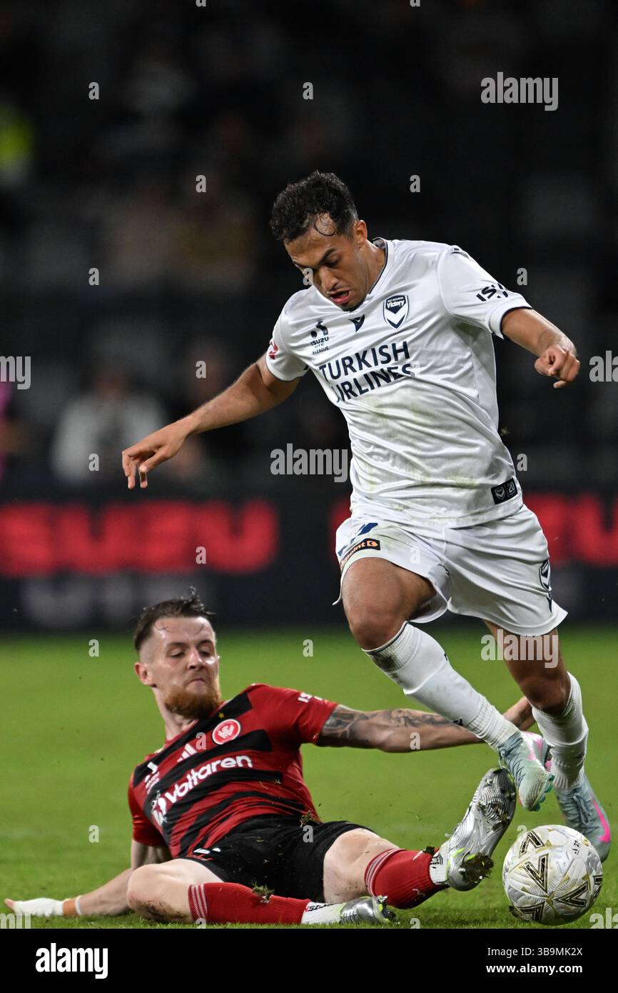 Anthony Pantazopoulos of the Wanderers with a sliding tackle on Nishan ...