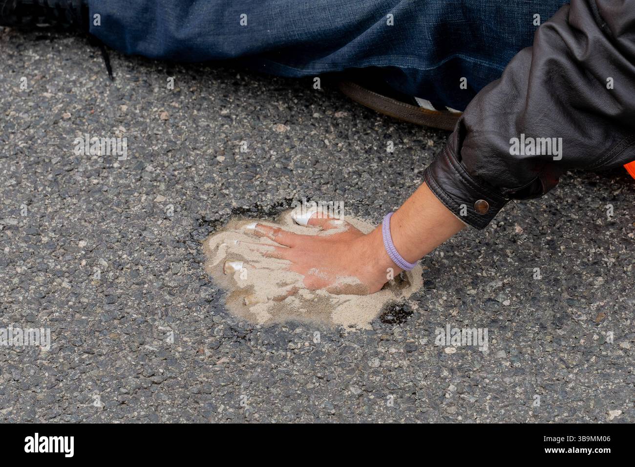 A member of the Ostatnie Pokolenie (Last Generation) climate activism ...