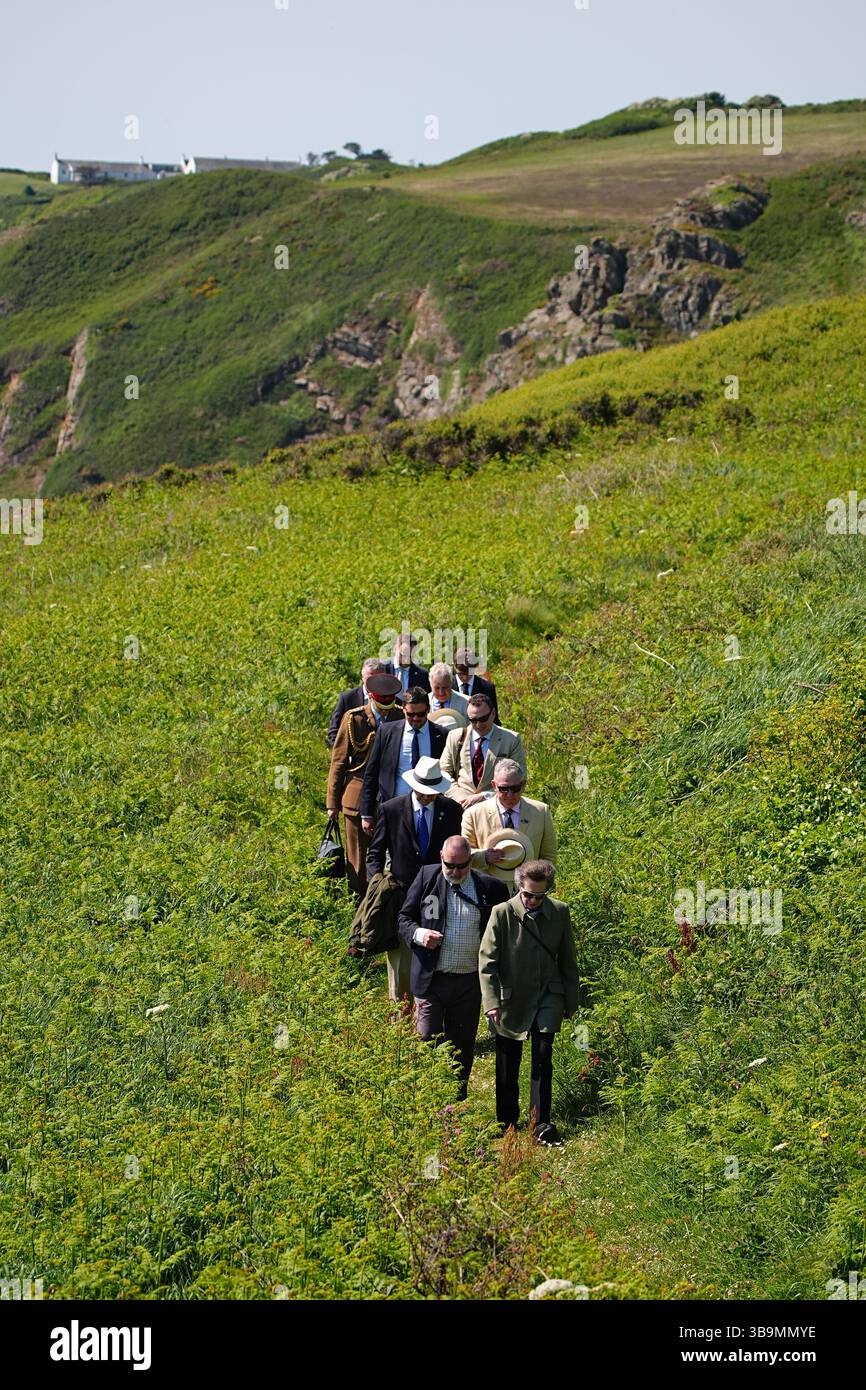 The Princess Royal walking along the East Coast Path in Sark, as she attends commemorations in ...