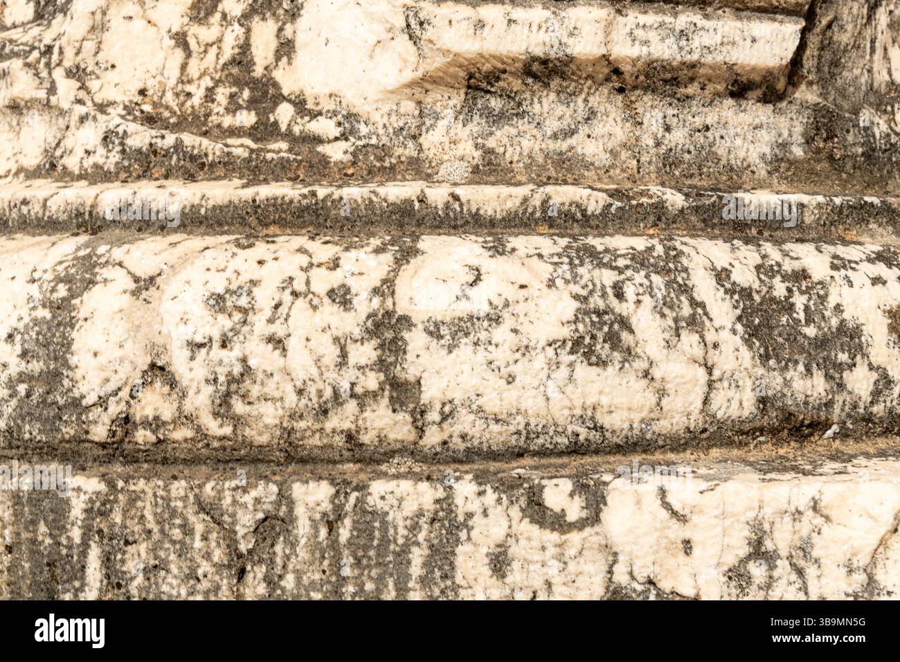Weathered base of a column; part of the historical ruins of an ancient ...