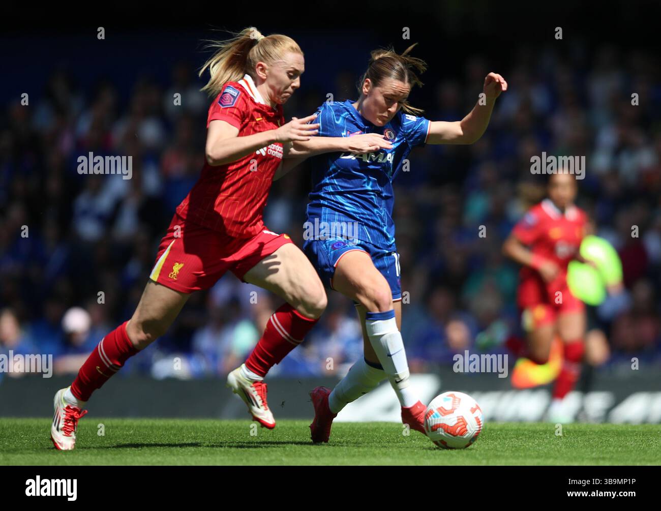 Chelsea’s Wieke Kaptein (right) and Liverpool's Ceri Holland (left ...
