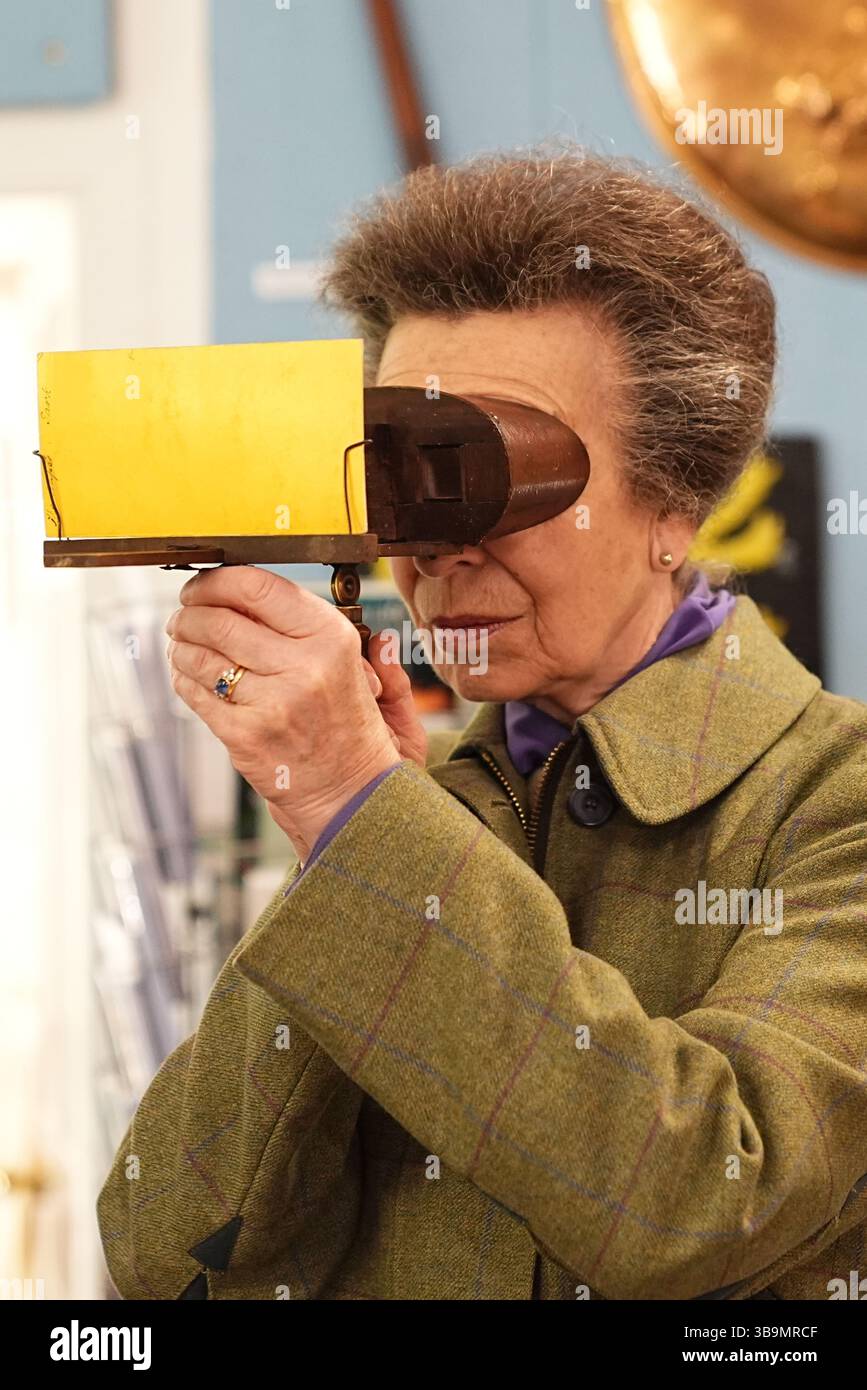 The Princess Royal looking at photos using a stereoscopic viewer during ...