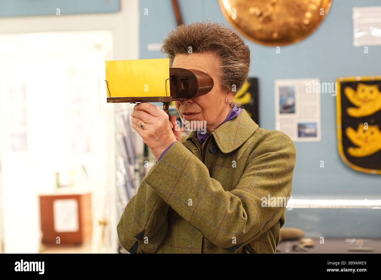 The Princess Royal looking at photos using a stereoscopic viewer during ...