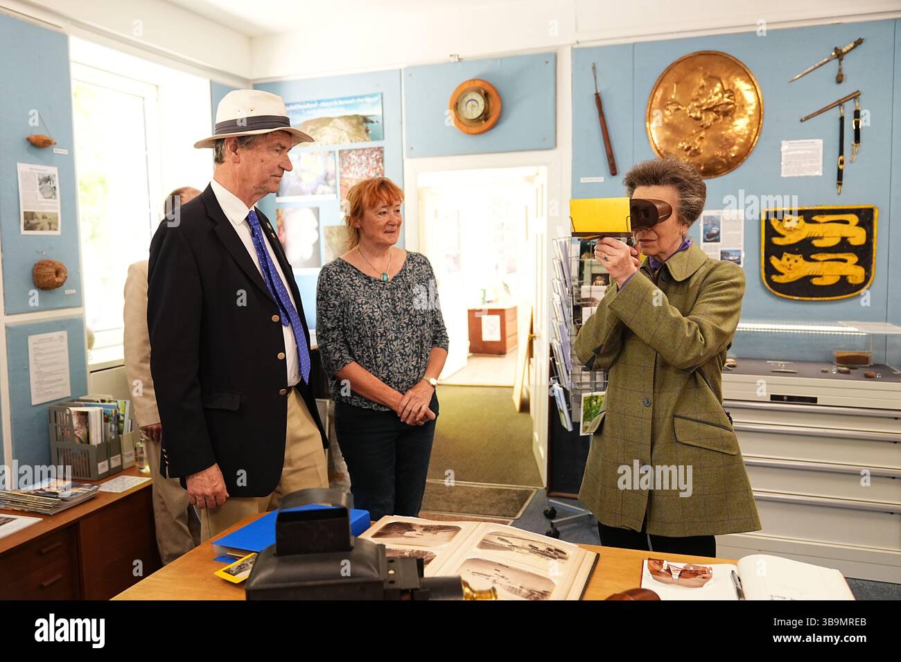 The Princess Royal looking at photos using a stereoscopic viewer during ...