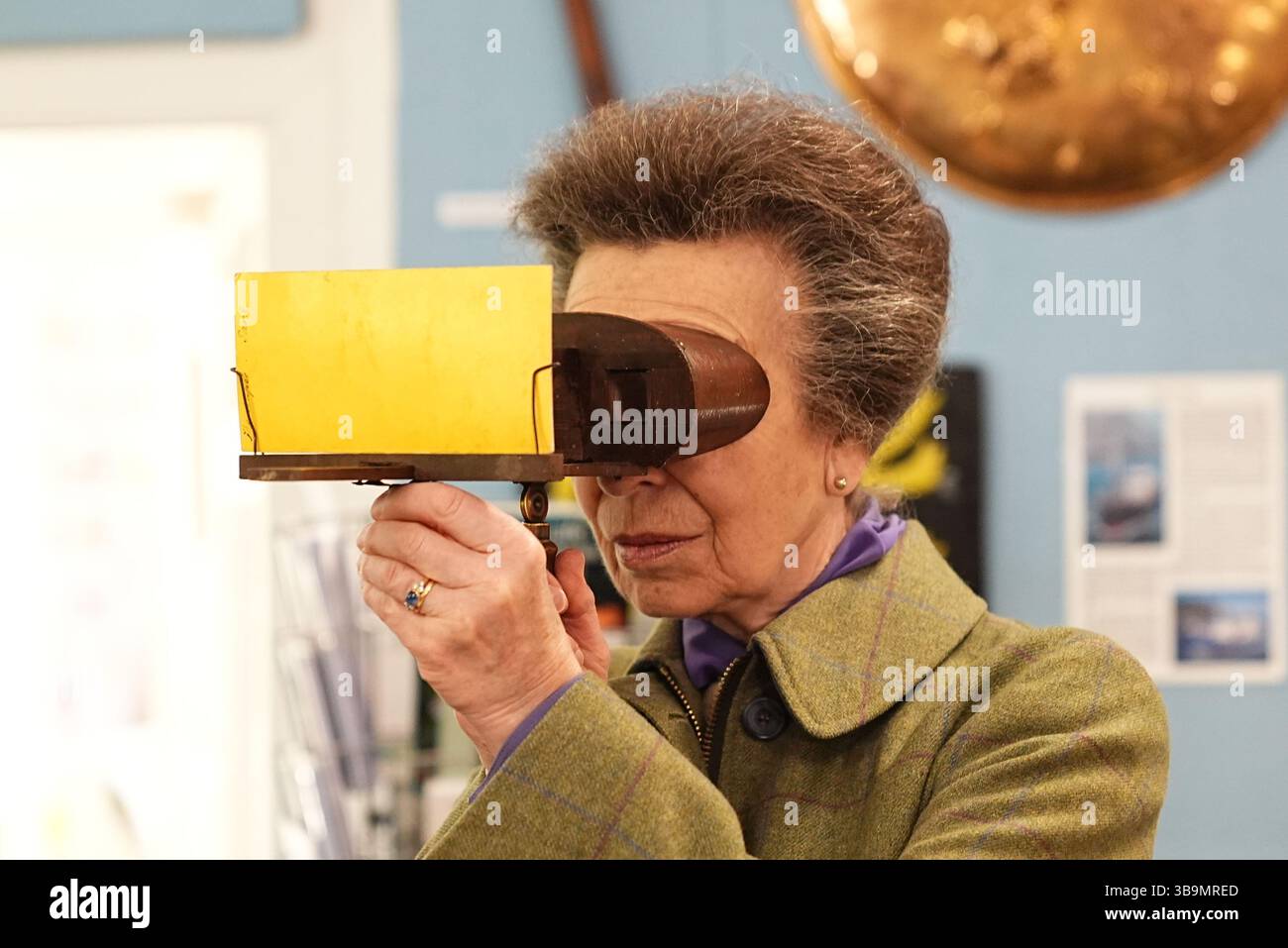 The Princess Royal looking at photos using a stereoscopic viewer during ...