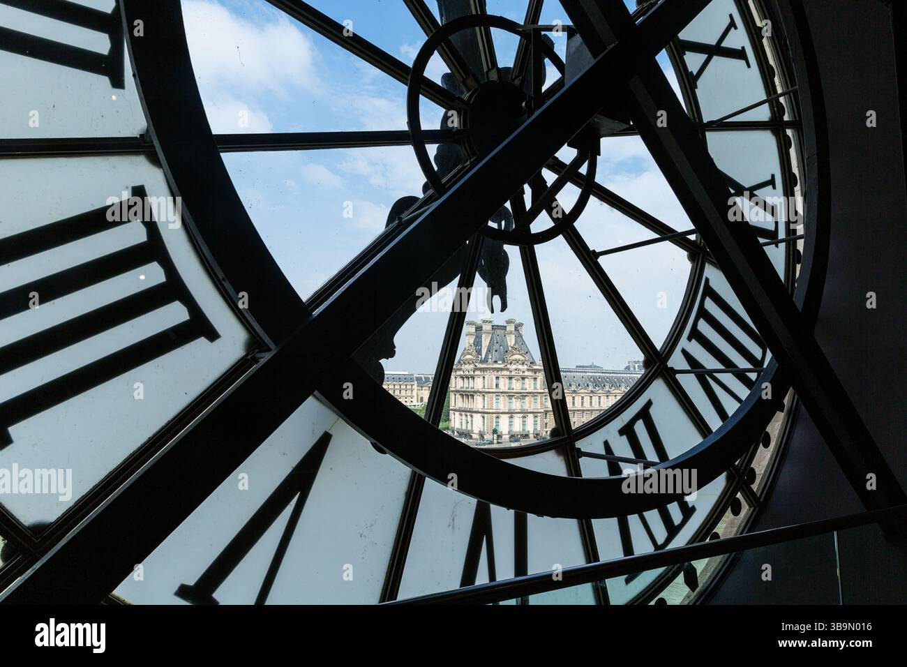 View of the Louvre, visible through the huge clock of the Museum de ...