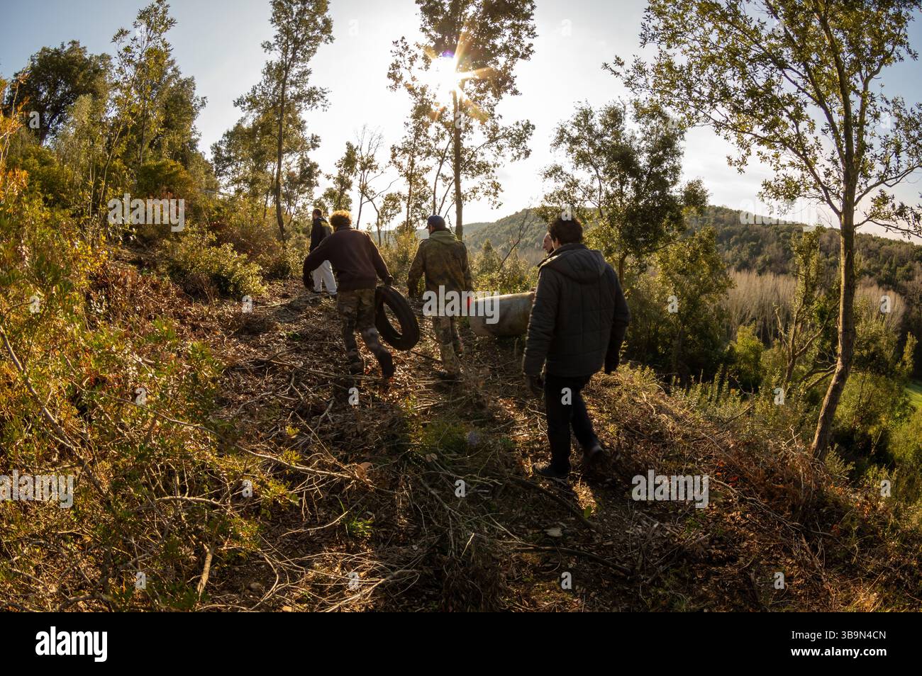 Volunteers gather to remove trash from the woods, showing dedication to ...