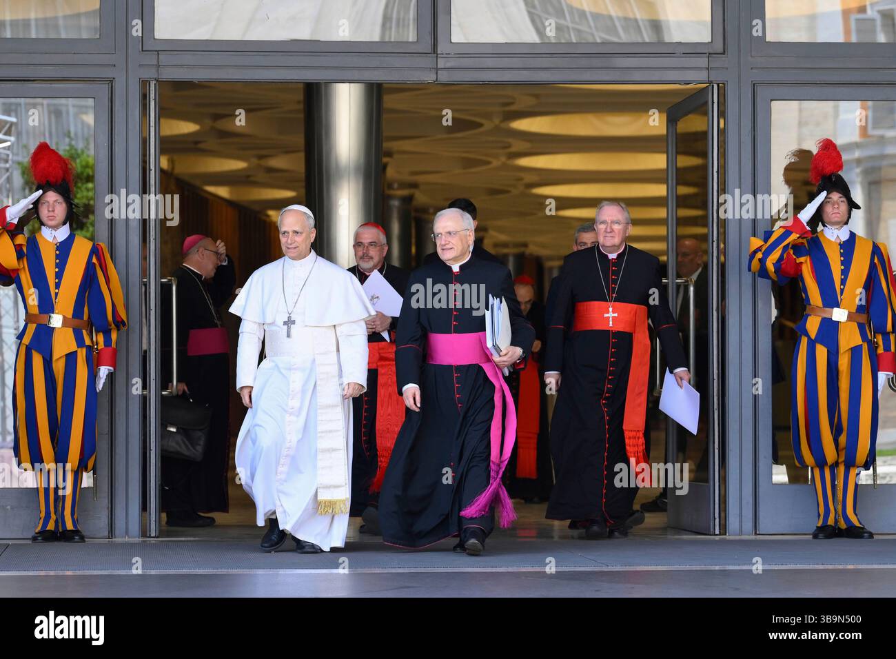 Pope Leo XIV, left, is flanked by Monsignor Leonardo Sapienza, second ...