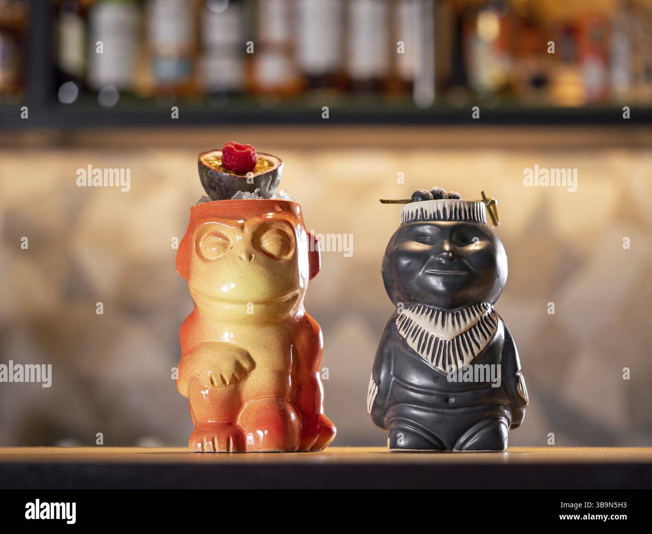 Tiki Drink Cocktails. Two tropical tiki cocktails on bar counter. Tiki ...