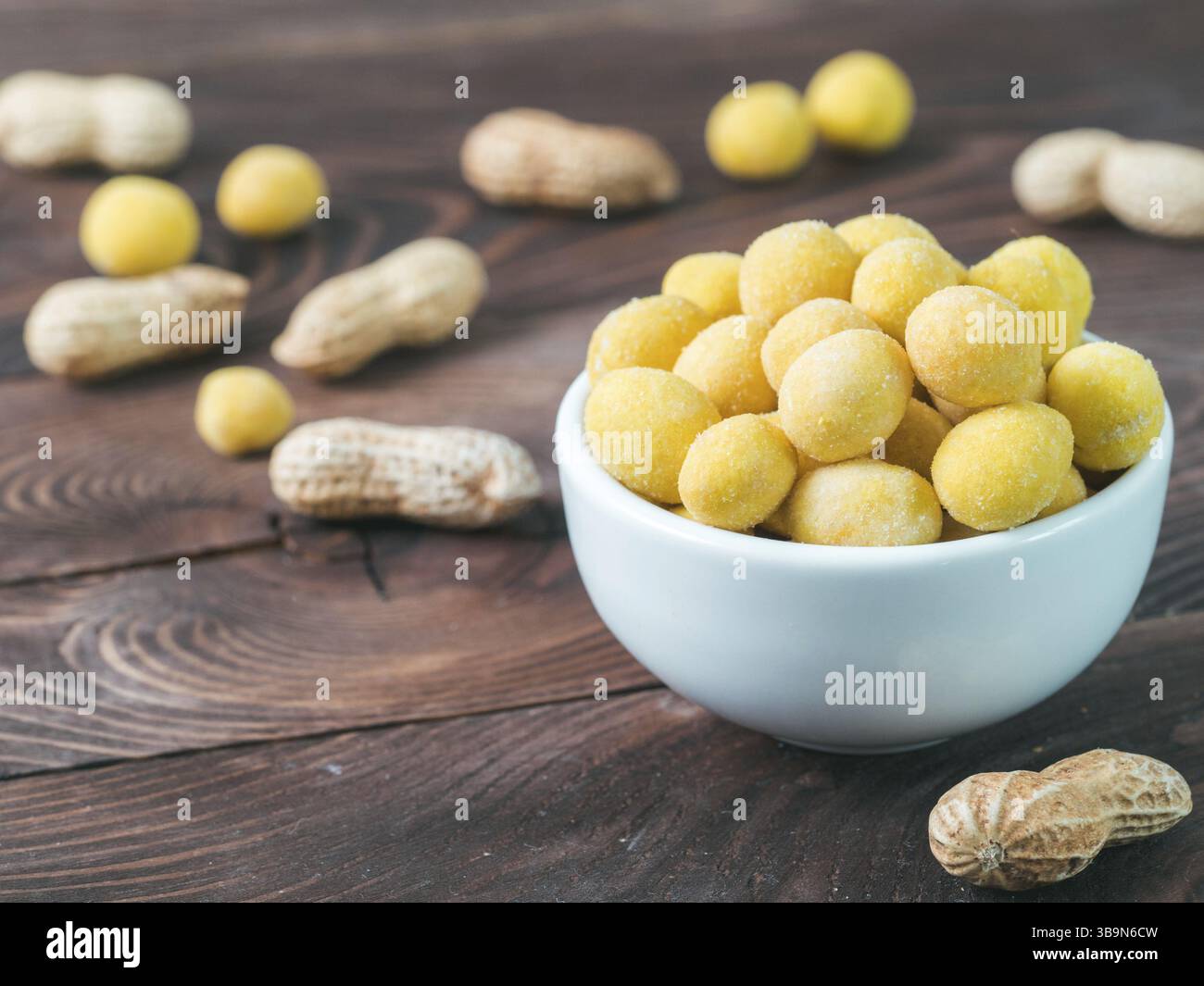 Peanut snack for beer, wine, party bar. Salted peanuts in yellow cheese ...