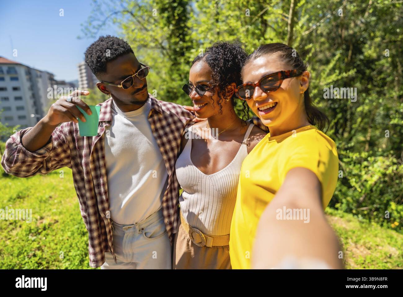 Cheerful group friends happily relishing hi-res stock photography and ...