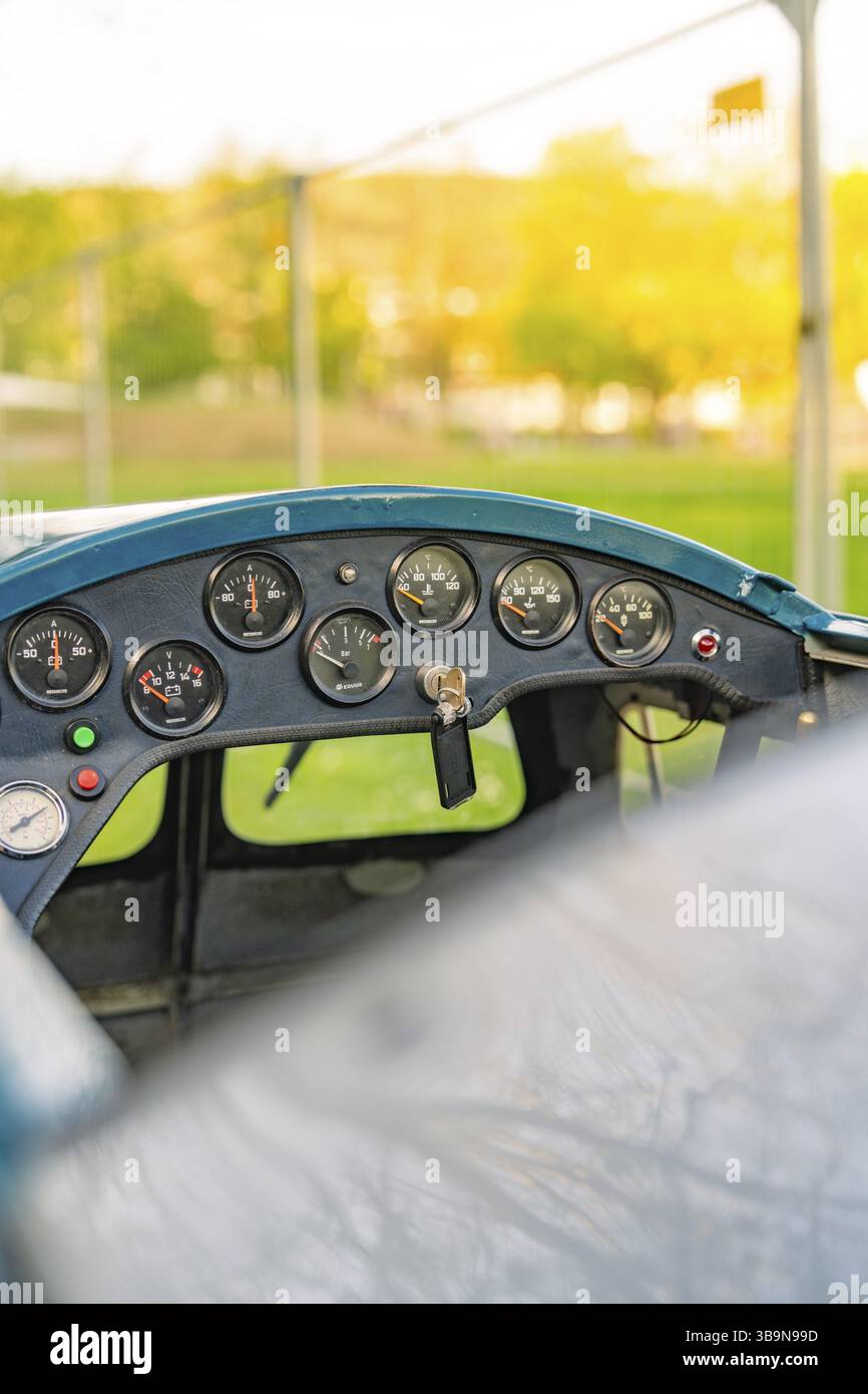 Detailed view of a retro aircraft cockpit with many instruments and ...