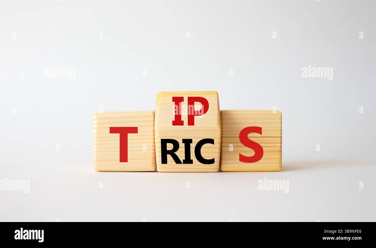 Tips and Tricks symbol. Wooden cubes with words Tricks and Tips. Beautiful white background ...