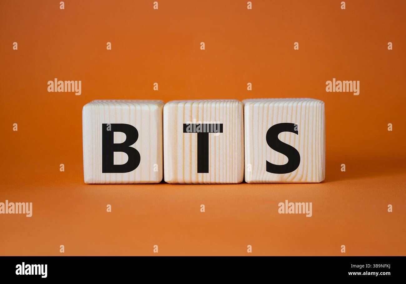 BTS symbol. Wooden cubes with word BTS. Beautiful orange background ...