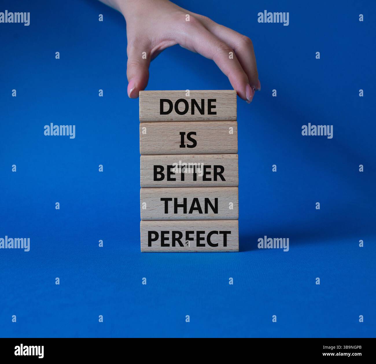 Done is better than Perfect symbol. Wooden blocks with words Done is ...