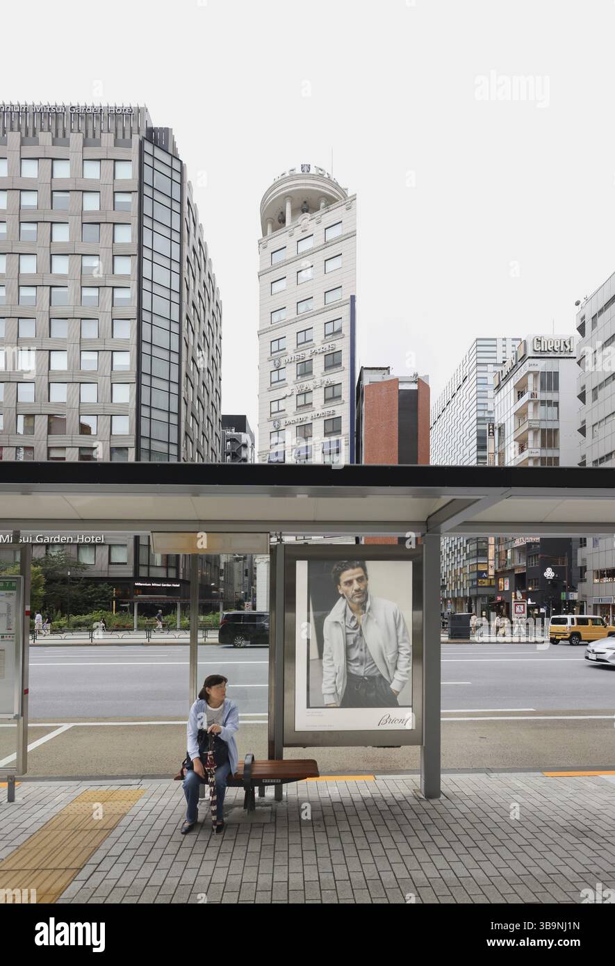 Woman sitting at bus stop in Tokyo, Ginza, Japan, Asia Stock Photo - Alamy