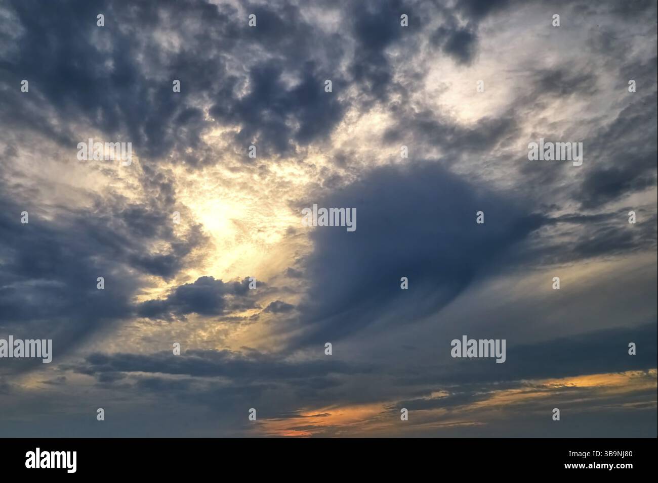 Heavy dark clouds at sunset. Sky background. Cloudy weather before rain ...