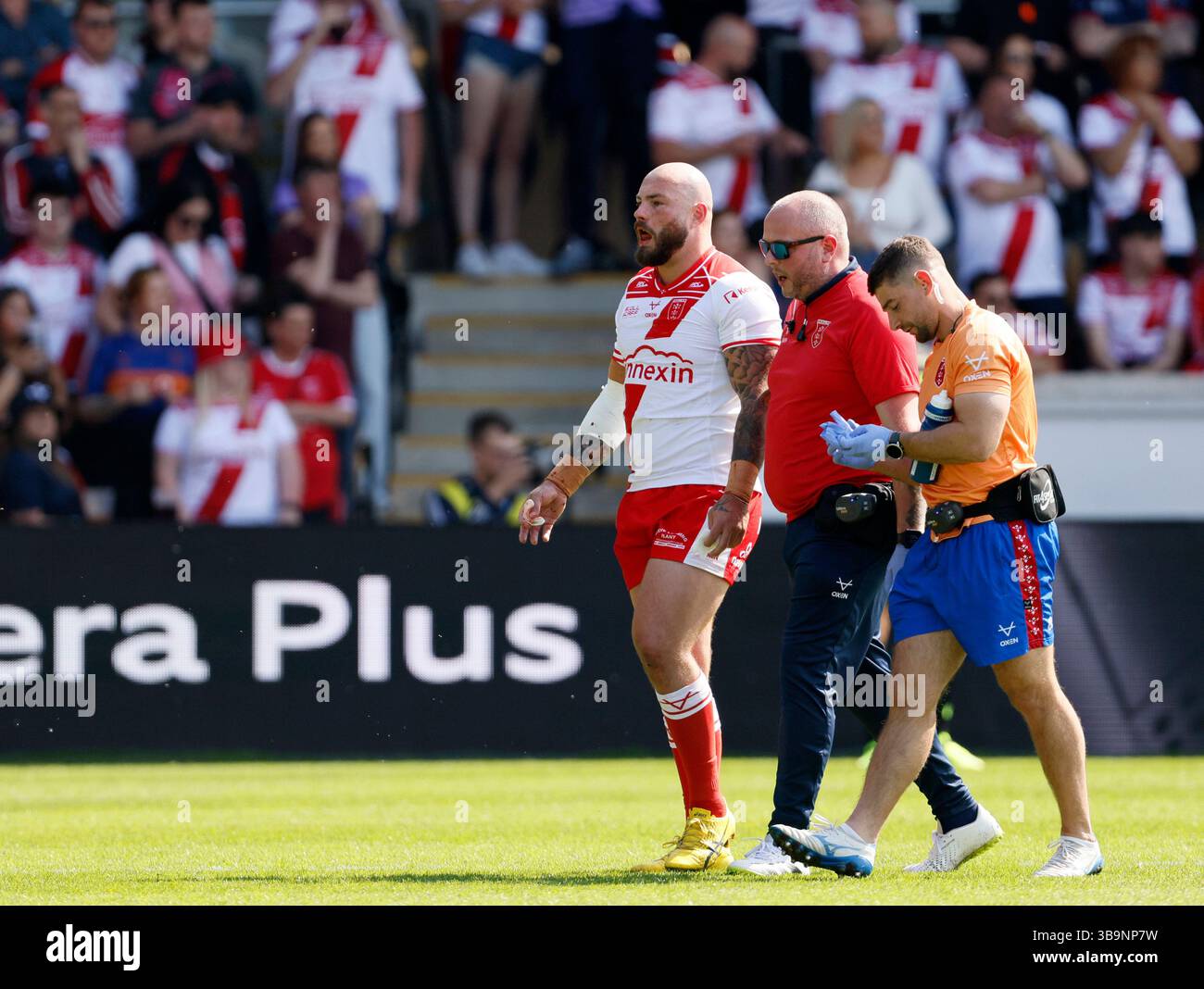 Hull KR's Sam Luckley (left) leaves the pitch with an injury during the ...
