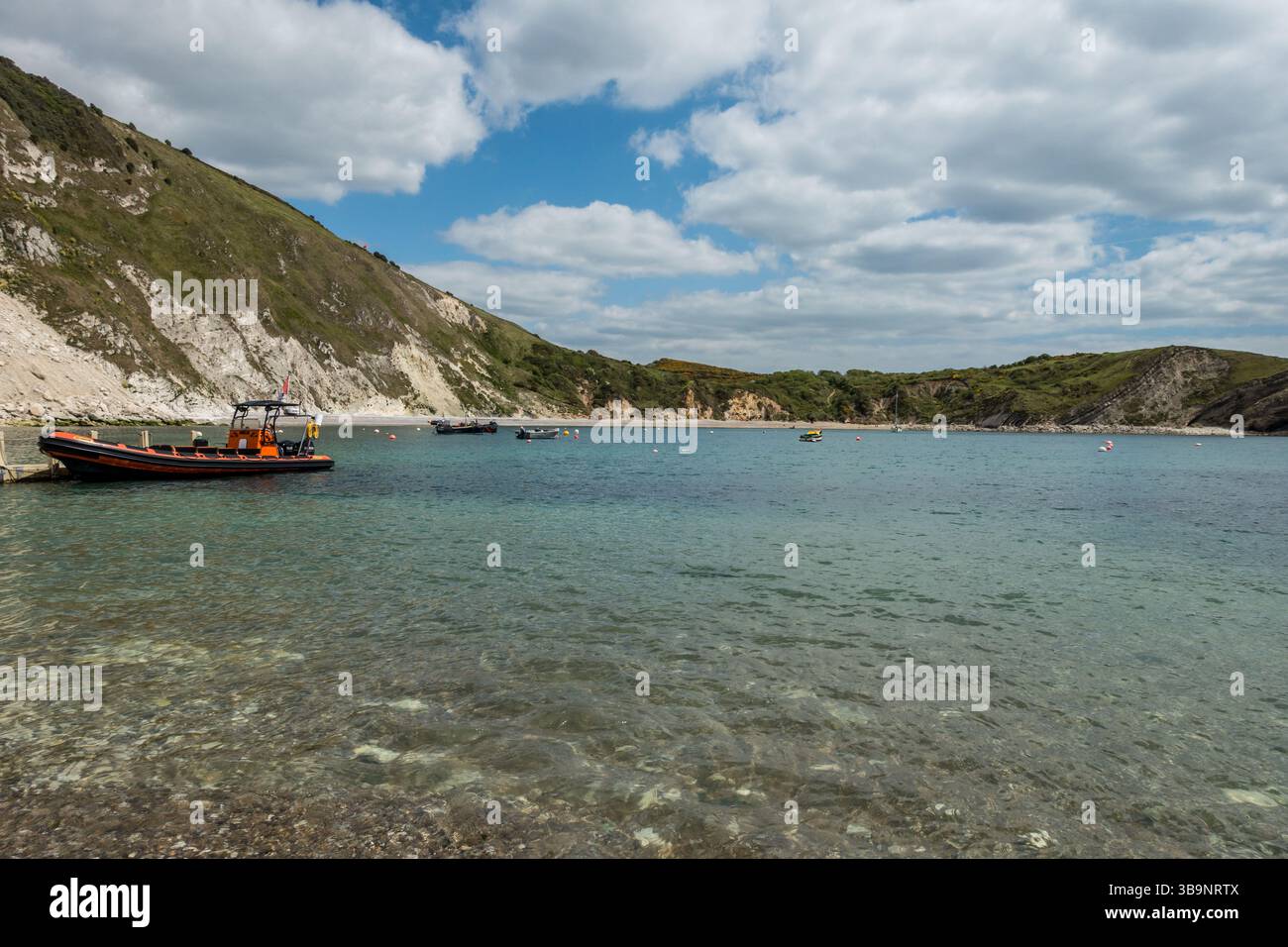 The pebble beach at Lulworth Cove Stock Photo - Alamy