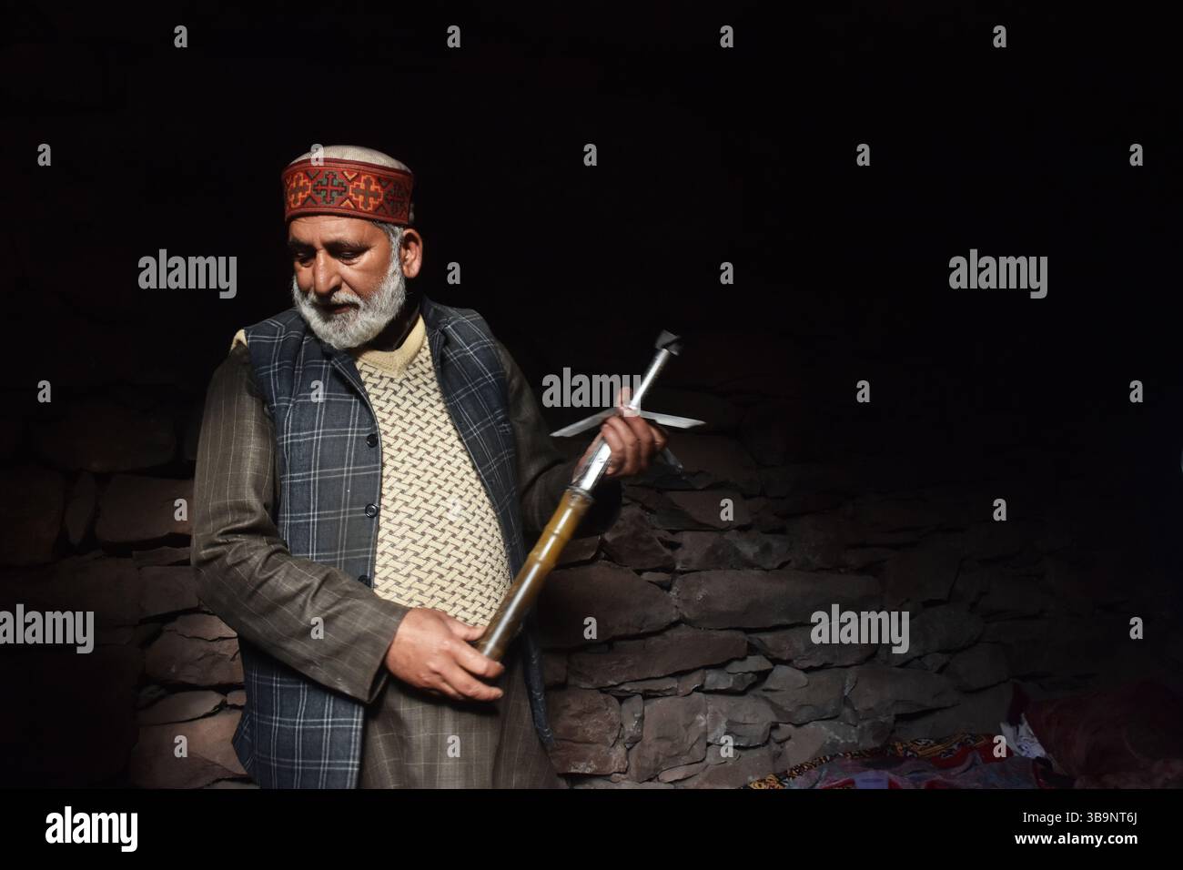 A Kashmiri Muslim man shows a shell that struck his home following ...