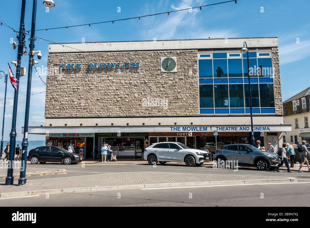 Front view of The Mowlem Theatre and shops in Swanage Stock Photo - Alamy