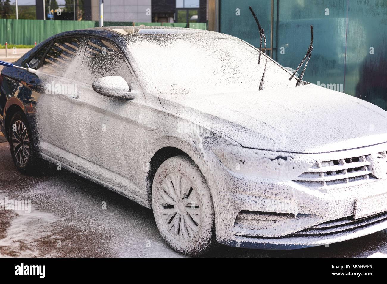 Manual car wash with high pressure washing outside Stock Photo - Alamy
