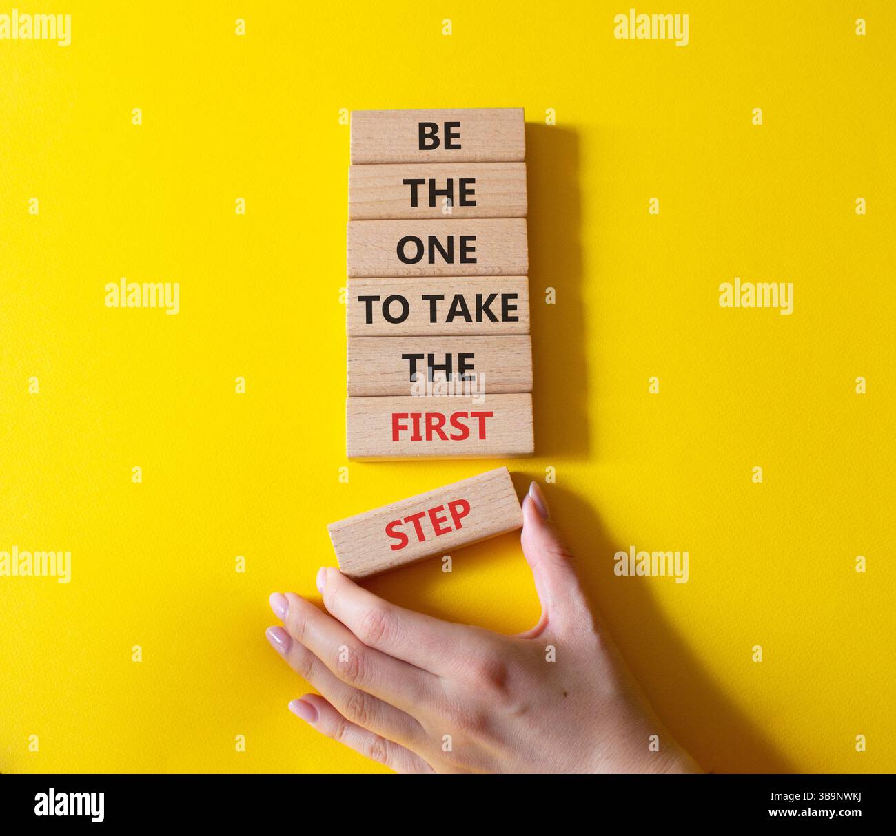 First step symbol. Wooden blocks with words Be the one to take the ...