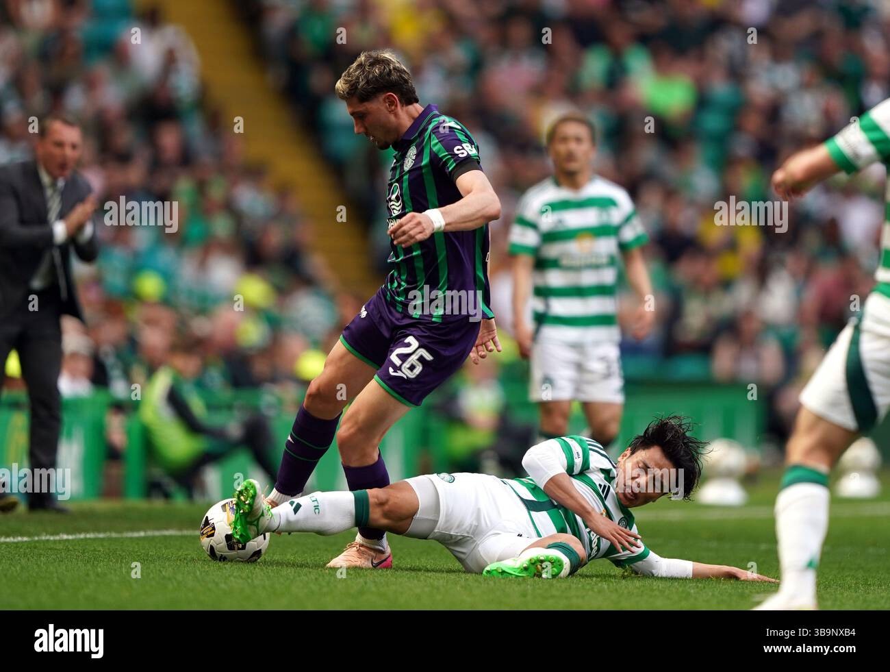 Celtic's Reo Hatate challenges Hibernian's Nectarios Triantis (left ...