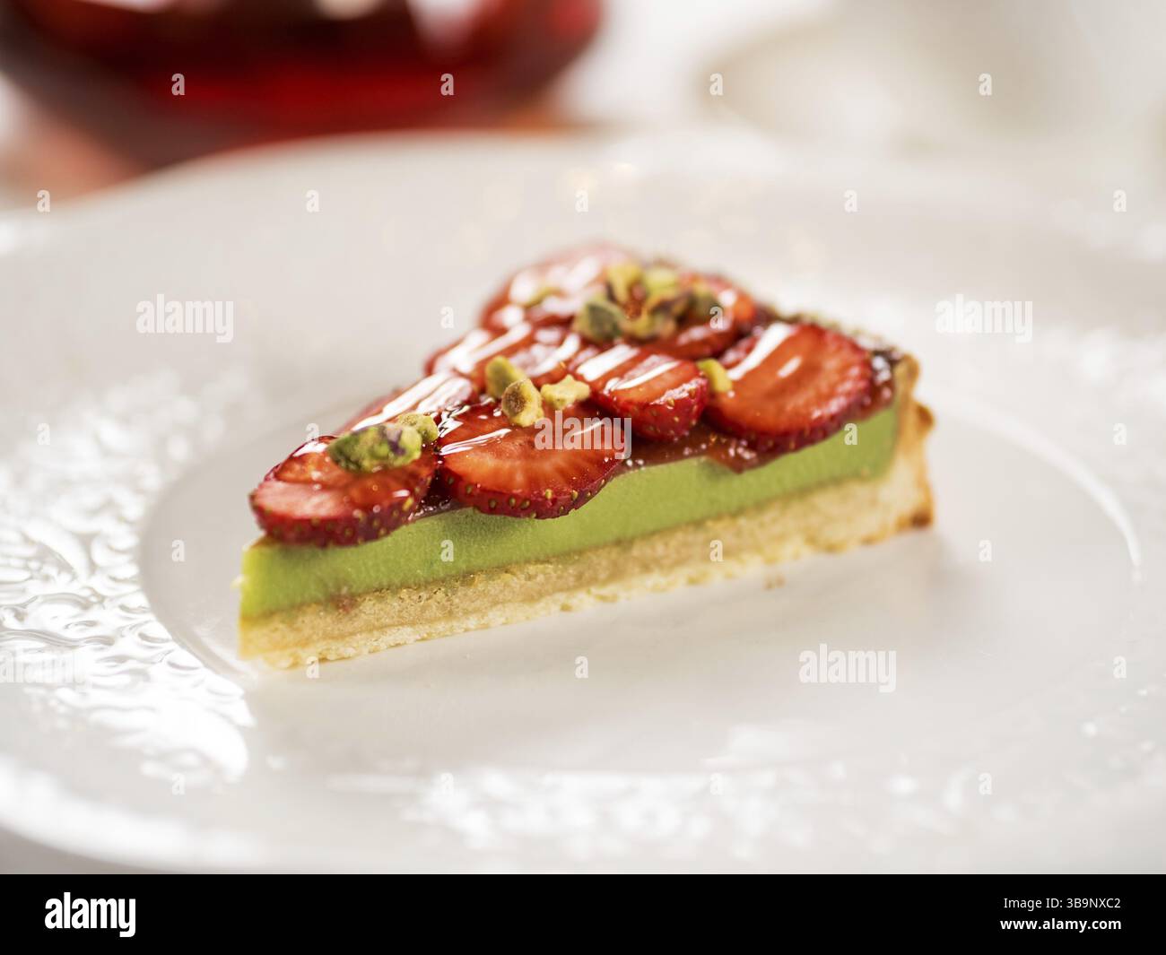 Pistachio cake decorated with strawberries. Crispy tart crust with ...
