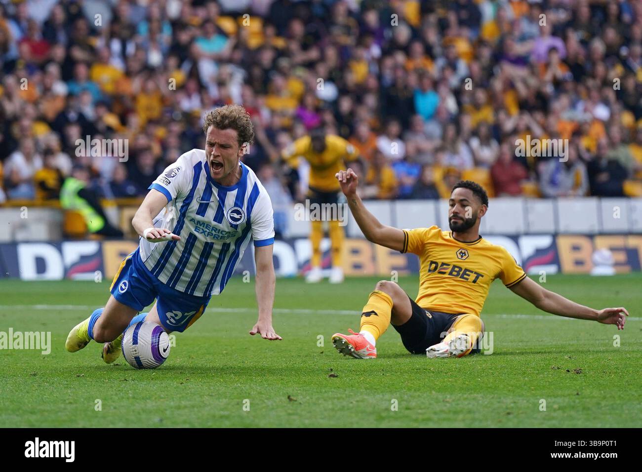 Brighton and Hove Albion's Mats Wieffer (left) is fouled for a penalty ...