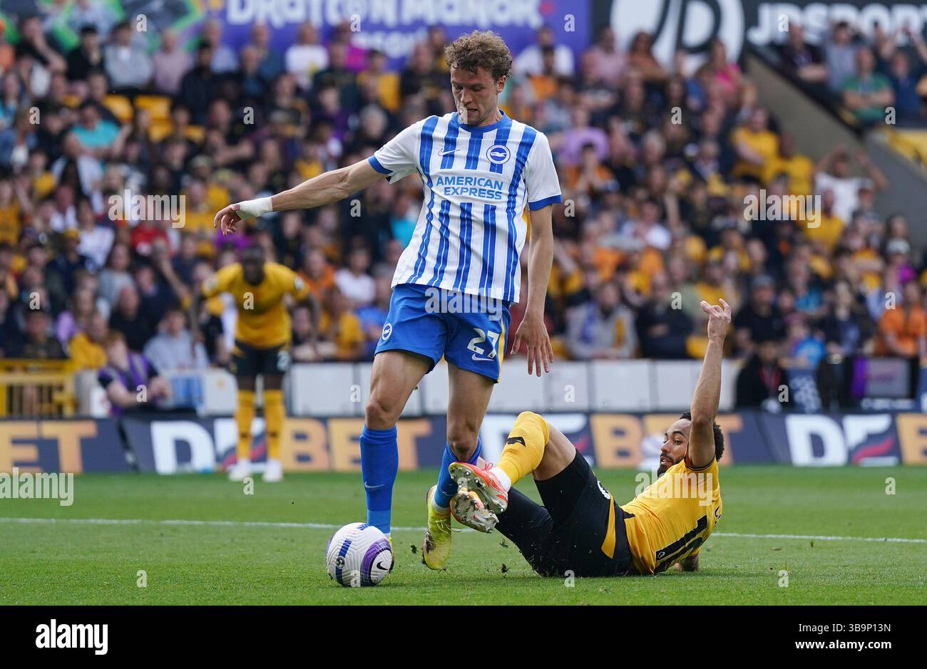 Brighton and Hove Albion's Mats Wieffer (left) is fouled for a penalty ...