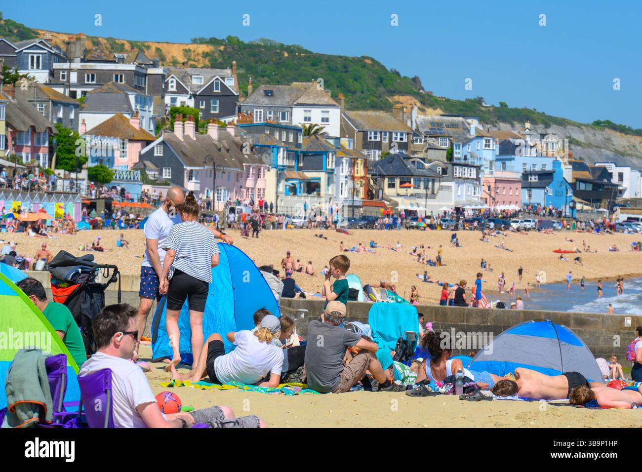 Lyme Regis, Dorset, UK. 10th May, 2025. UK Weather. Visitors and locals ...