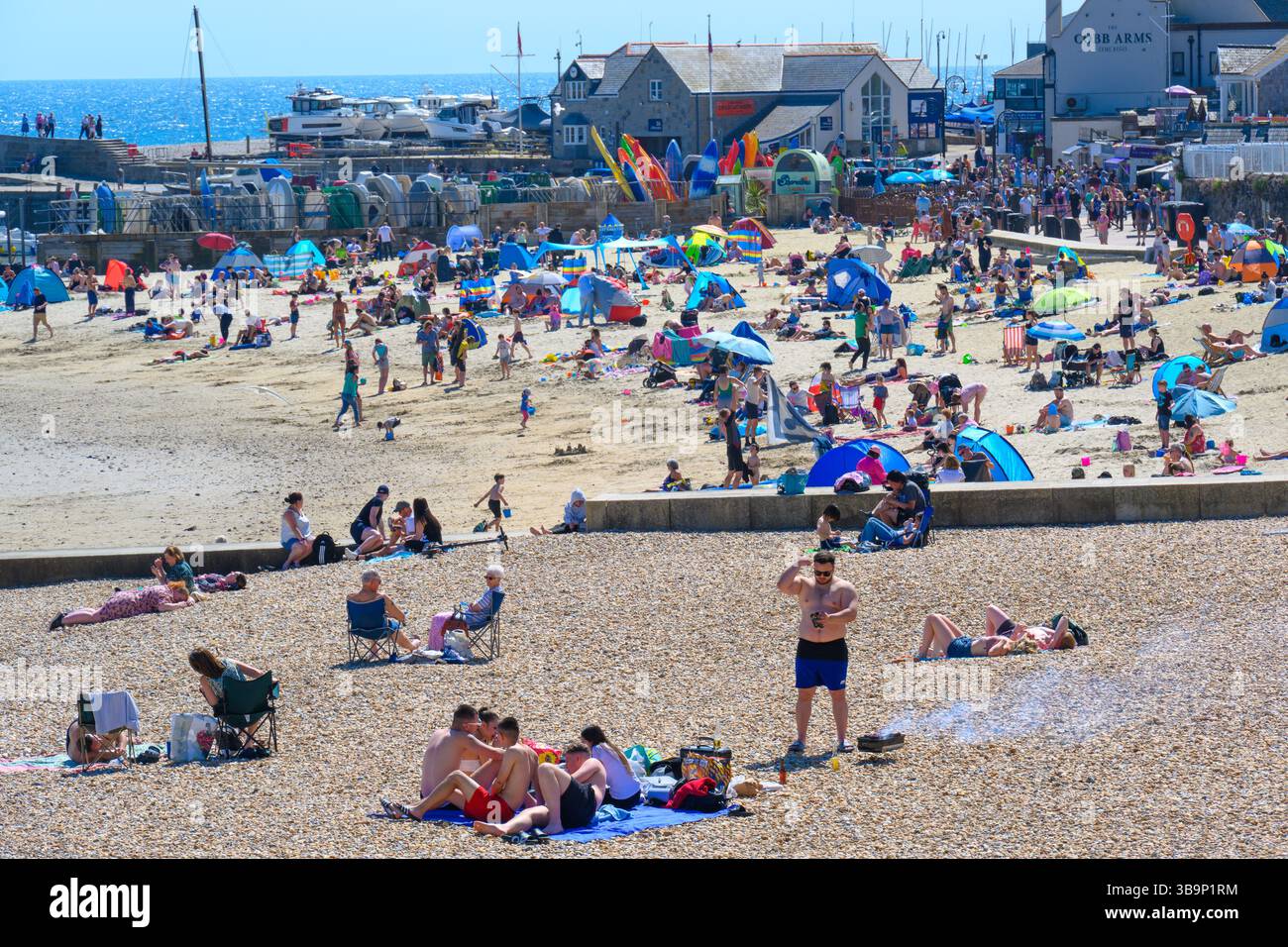 Lyme Regis, Dorset, UK. 10th May, 2025. UK Weather. Visitors and locals ...