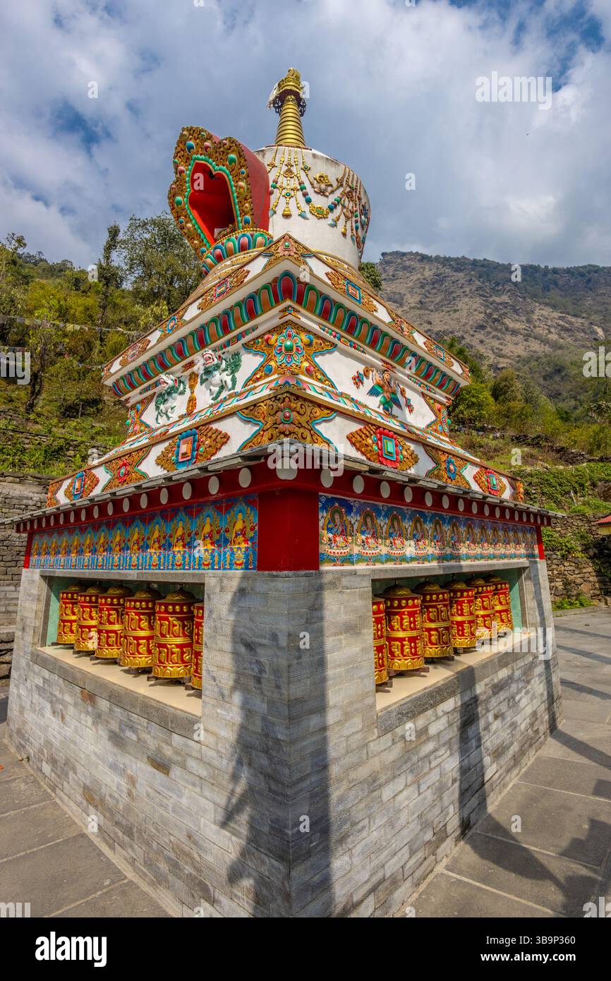 04042025 - Pokhara, Nepal. Buddhist stupa with red prayer wheels in ...