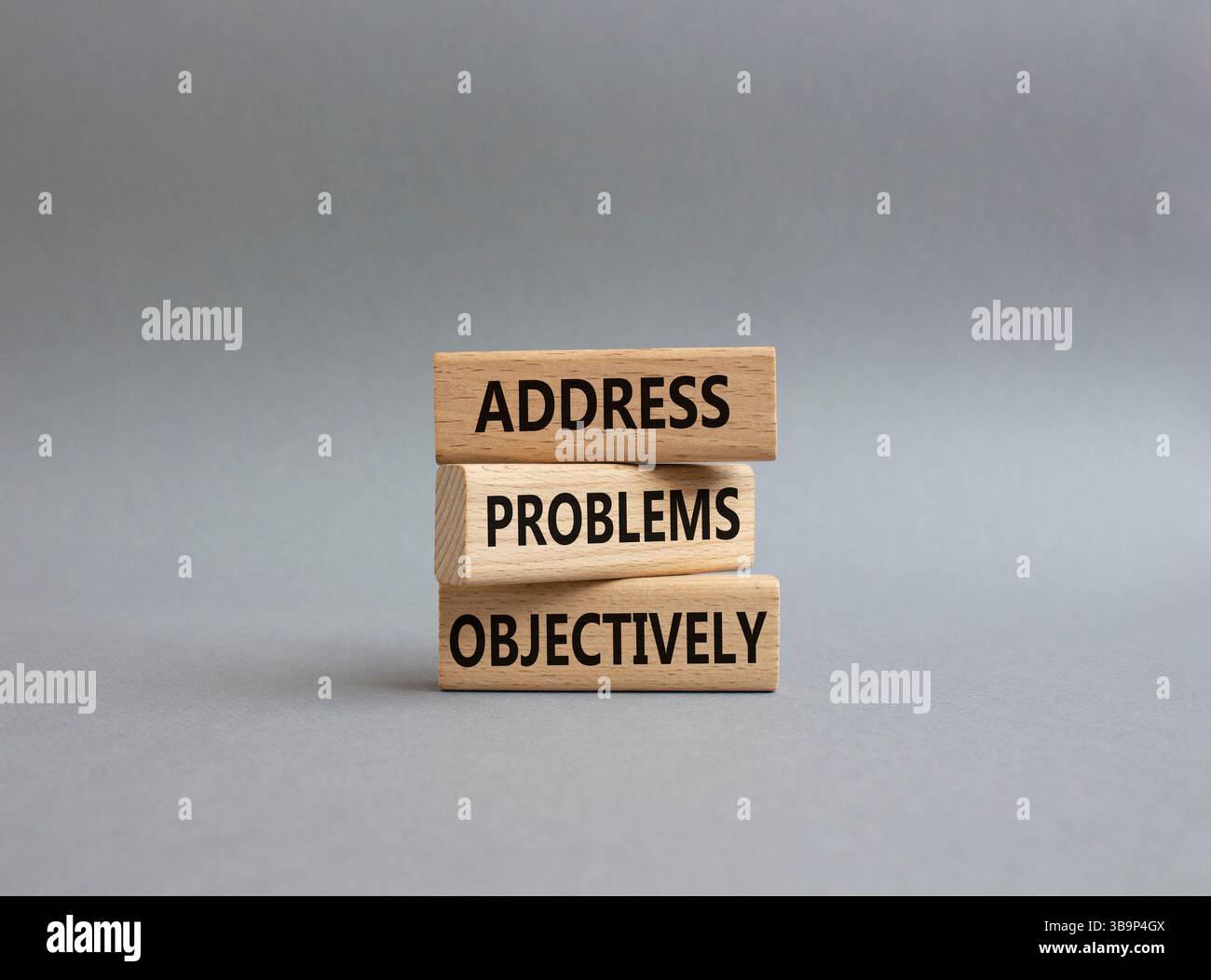 Address Problems Objectively symbol. Wooden blocks with words Address ...