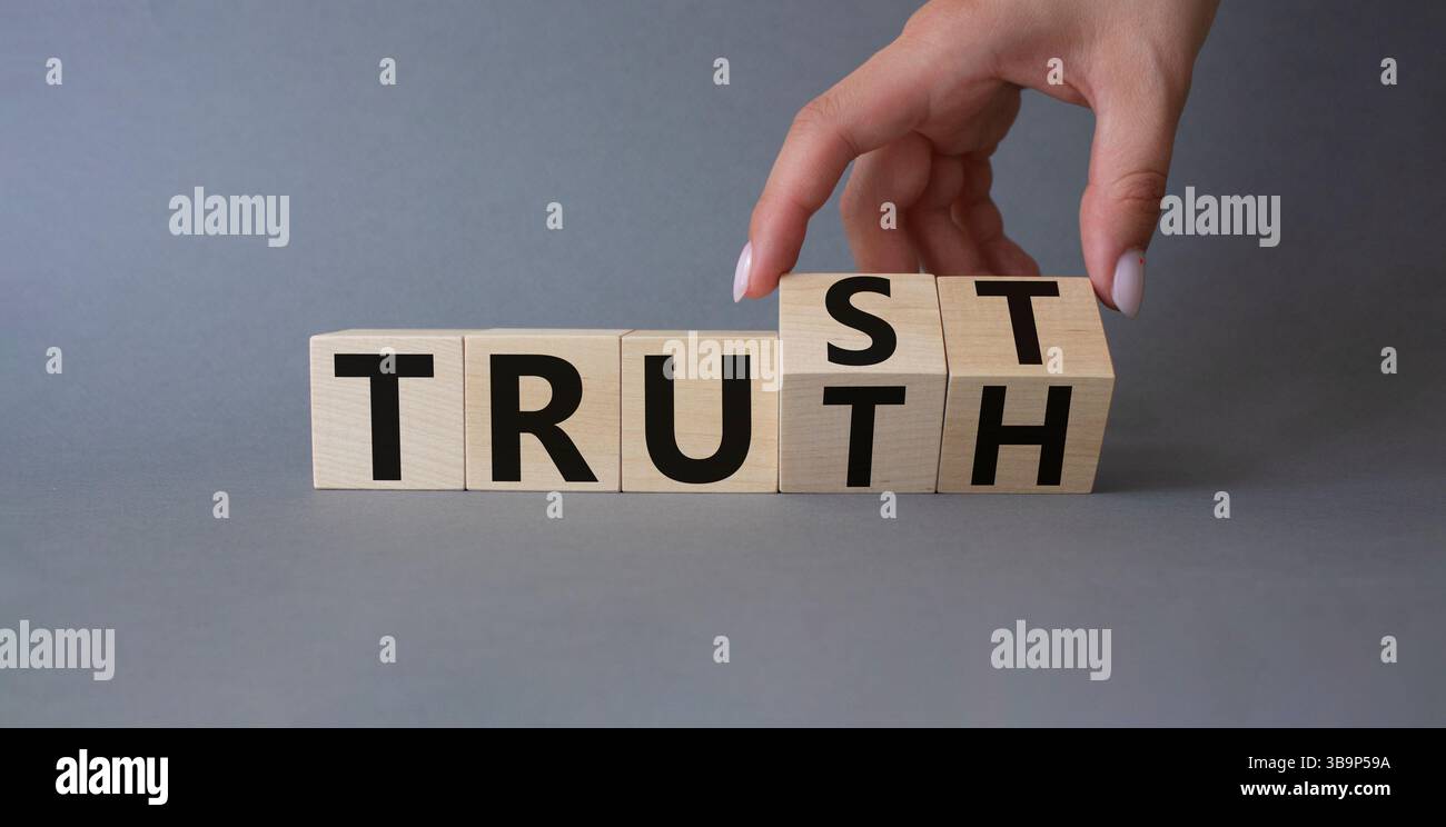 Trust and Truth symbol. Businessman hand Turnes cubes and changes word ...