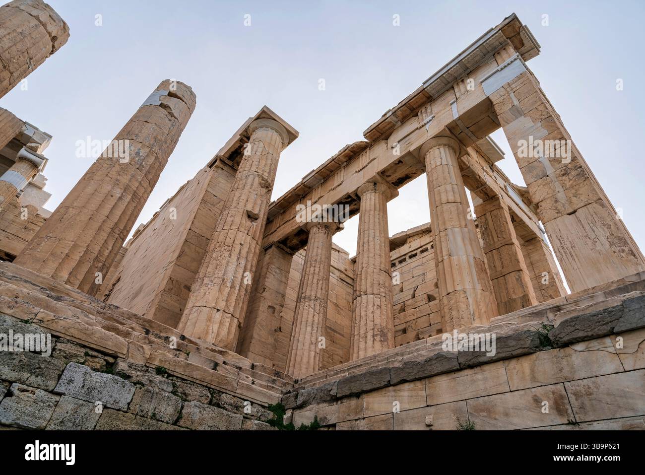 Low-angle view of the majestic marble columns of the Propylaea, the ...