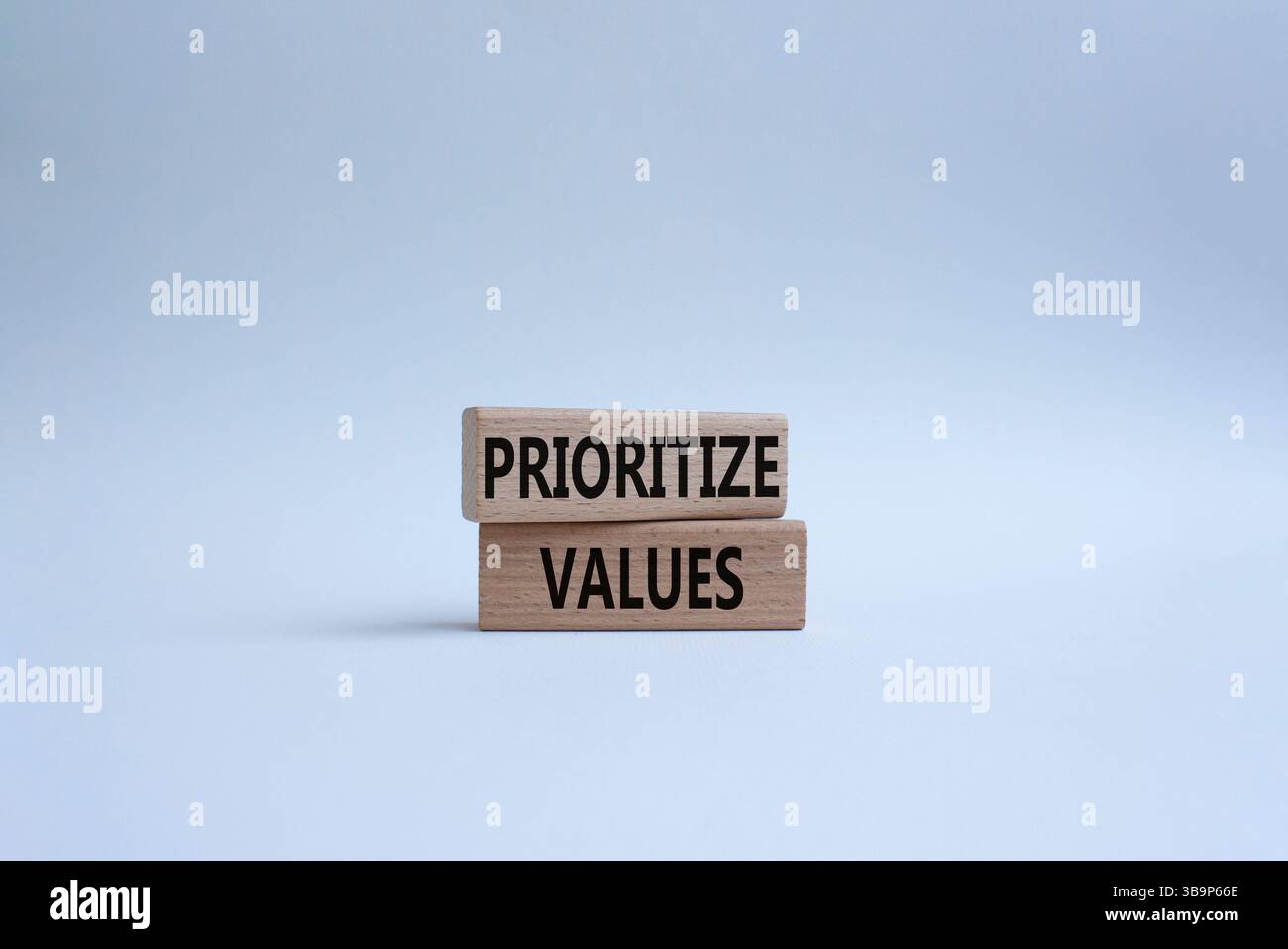 Prioritize values symbol. Concept word Prioritize values on wooden ...