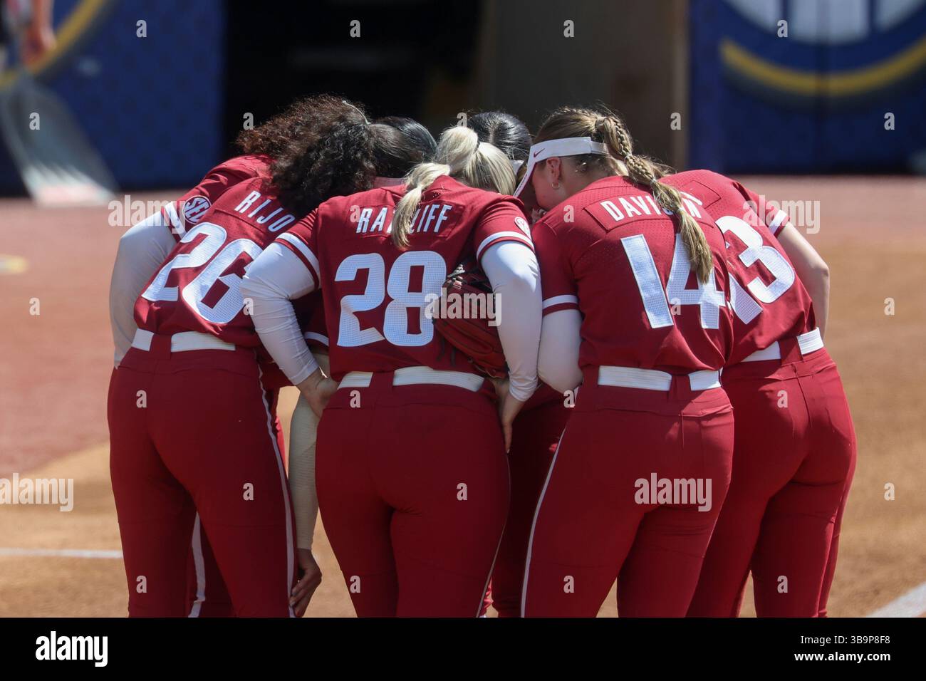 ATHENS, GA - MAY 09: Arkansas infielders huddle up before the SEC Softball Championship ...