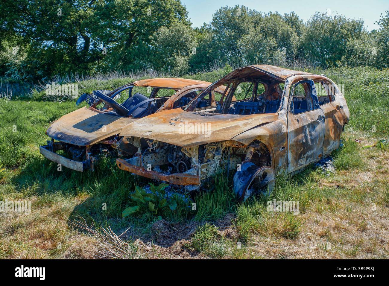 May 2025 - Burnt out wrecked cars, a BMW 1 series & and Opel or ...