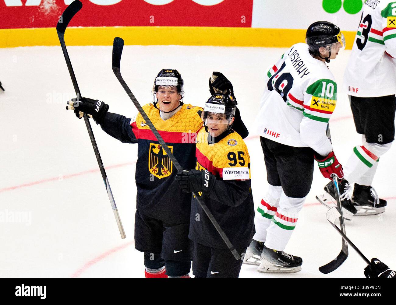 Germany's Josh Samanski, left, celebrates scoring during the group B ...