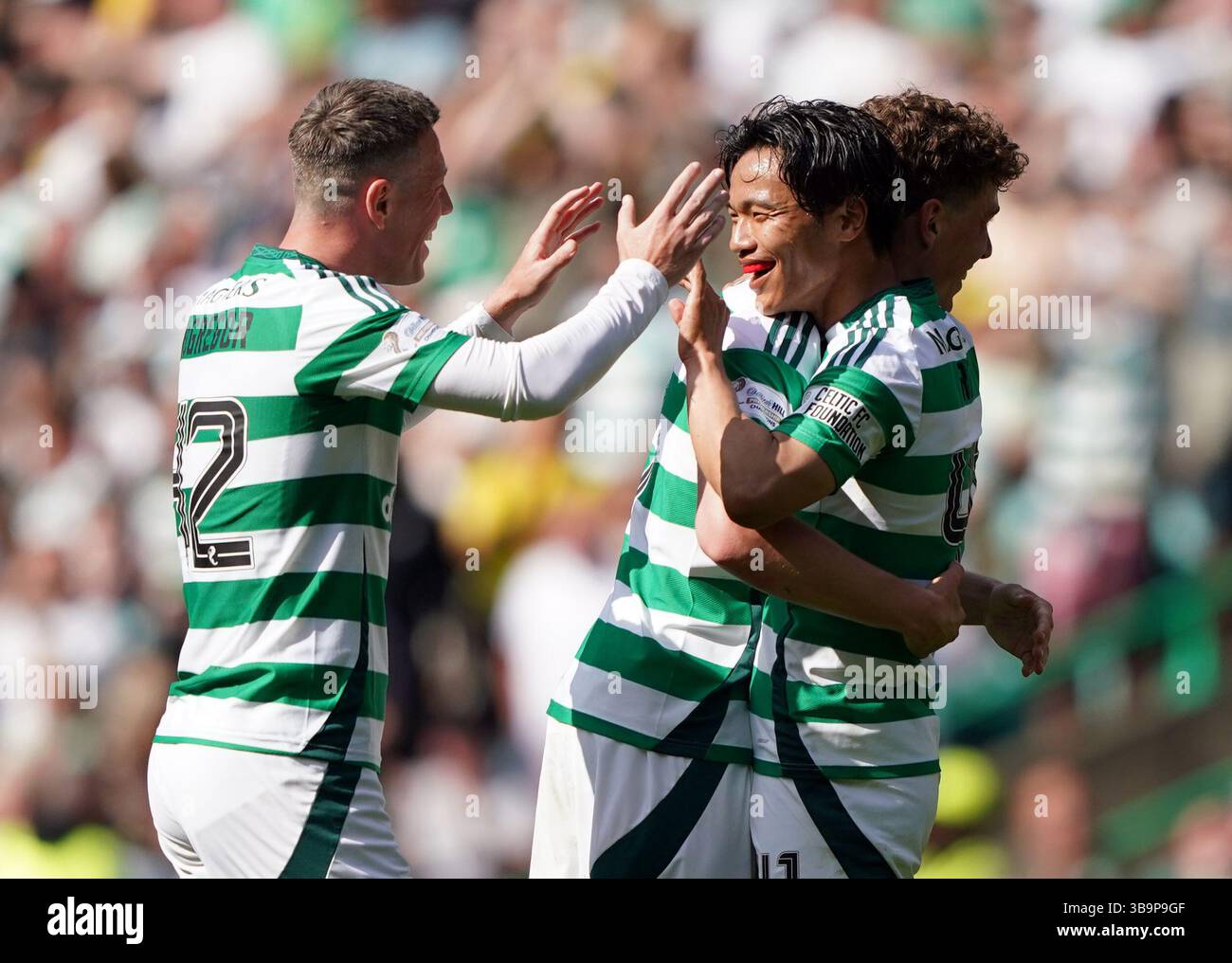 Celtic's Reo Hatate celebrates with team mates after scoring his sides ...