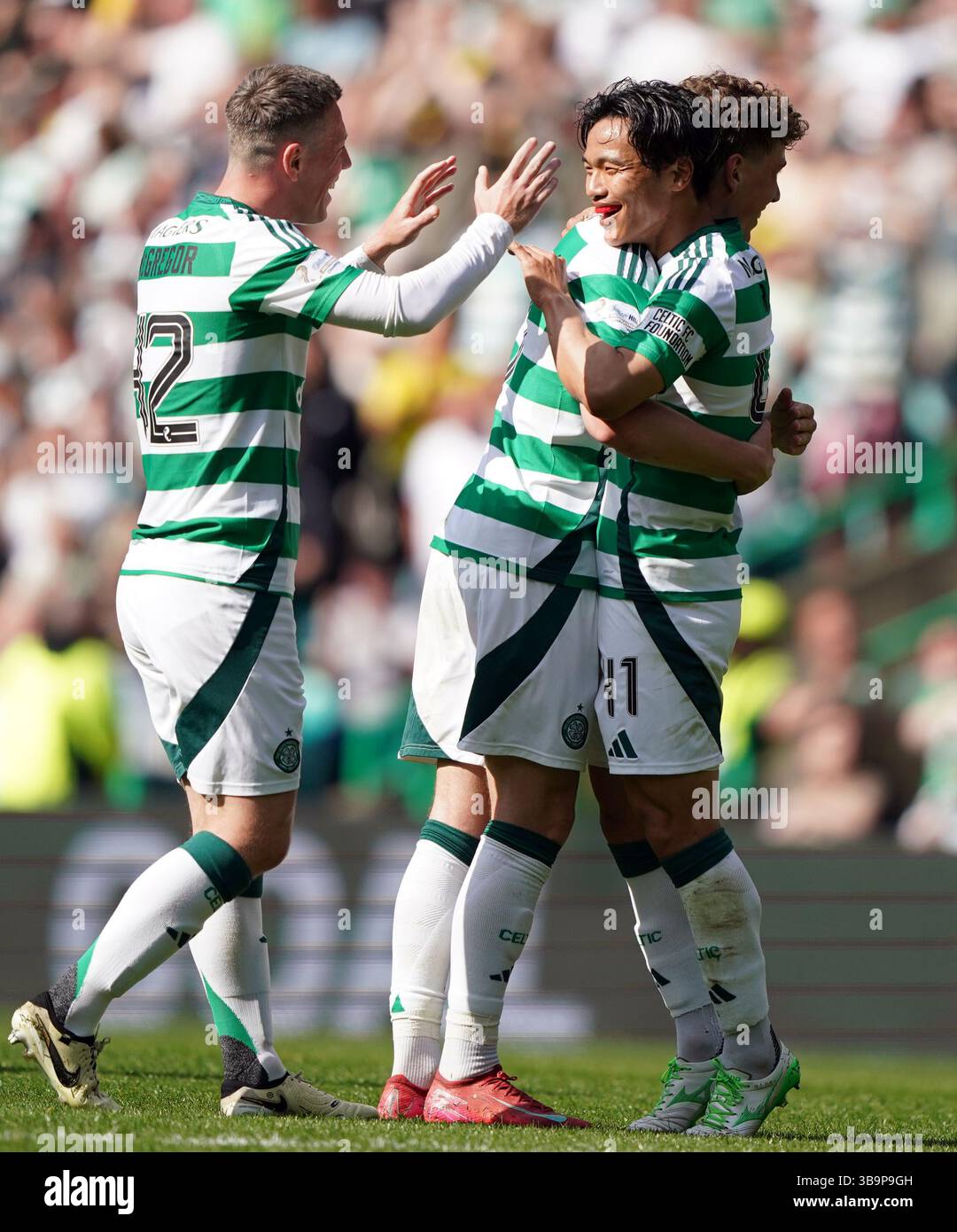 Celtic's Reo Hatate celebrates with team mates after scoring his sides ...