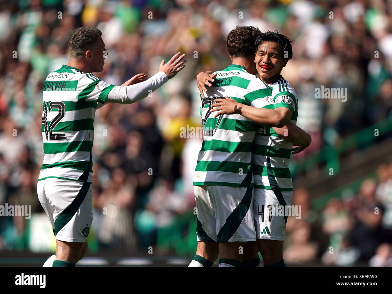 Celtic's Reo Hatate celebrates with team mates after scoring his sides ...
