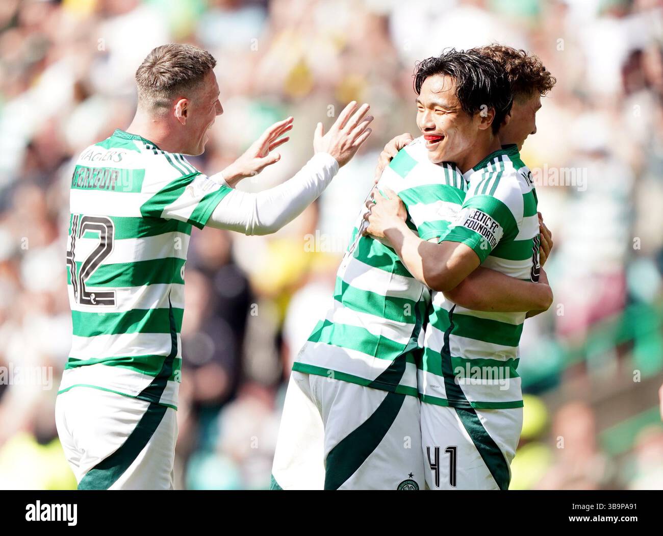 Celtic's Reo Hatate celebrates with team mates after scoring his sides ...