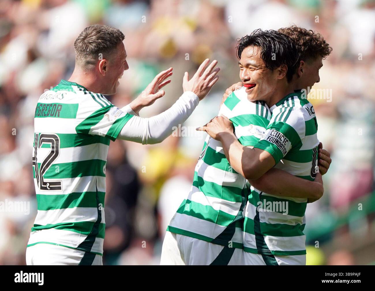 Celtic's Reo Hatate celebrates with team mates after scoring his sides ...