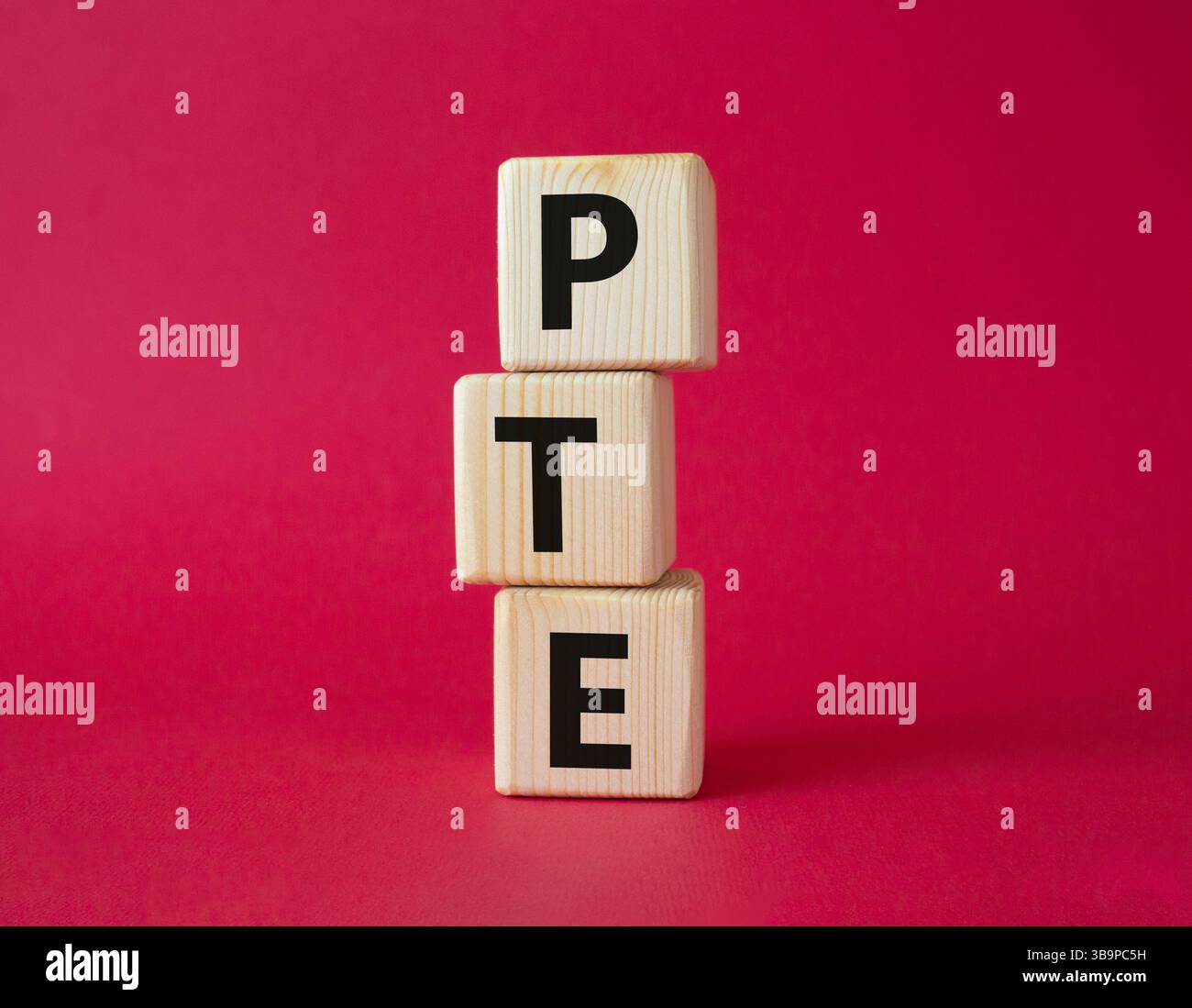 PTE - Pearson Tests of English symbol. Wooden cubes with word PTE ...