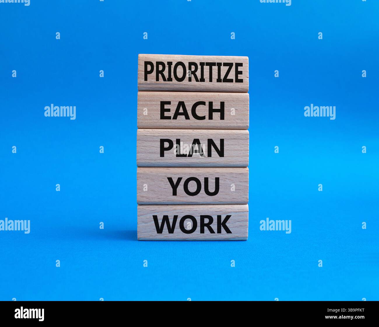 Priority, plan and work symbol. Wooden blocks with words Prioritize ...